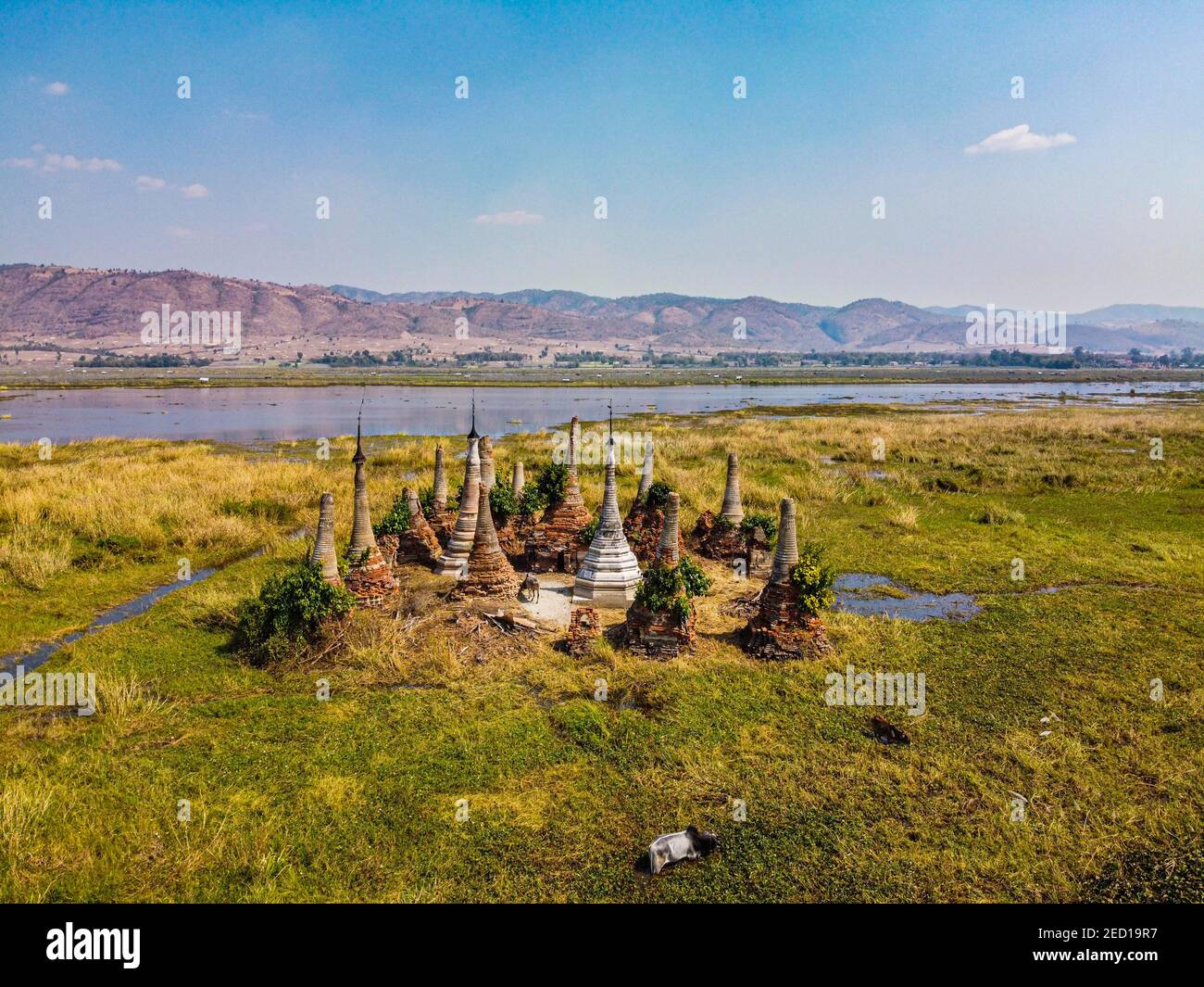 Aerial of little pagodas sitting in the waters of the southern Inle ...