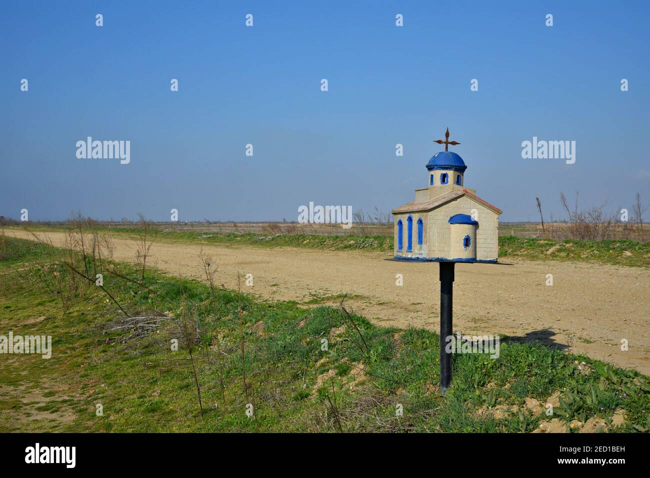 Landscape with a traditional Greek Orthodox roadside memorial shrine in ...