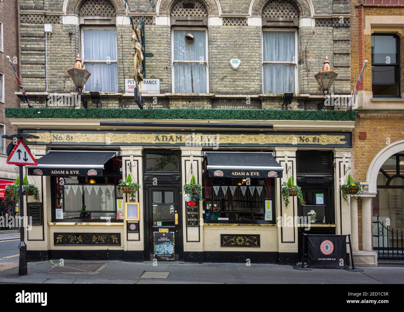 Facade of The Adam and Eve public house in the city of London, UK Stock ...