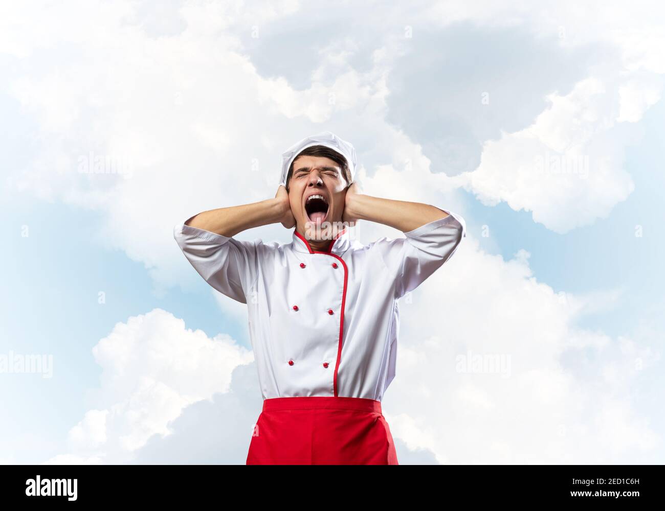 Young male chef screaming in shock and horror Stock Photo - Alamy