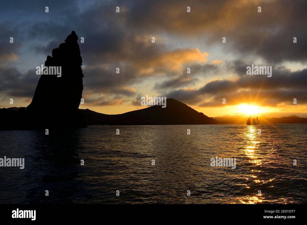 Pinnacle Rock at sunset with clouds, Bartolome Island, Galapagos ...