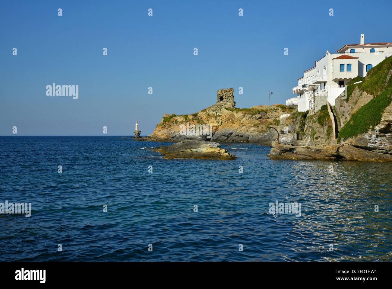 Landscape with scenic view of the ancient Tourlitis lighthouse landmark ...