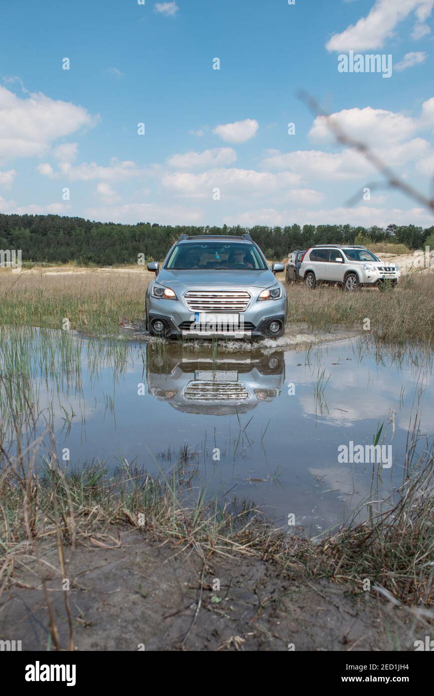 off road concept. car overcoming swamp barrier. copy space Stock Photo ...