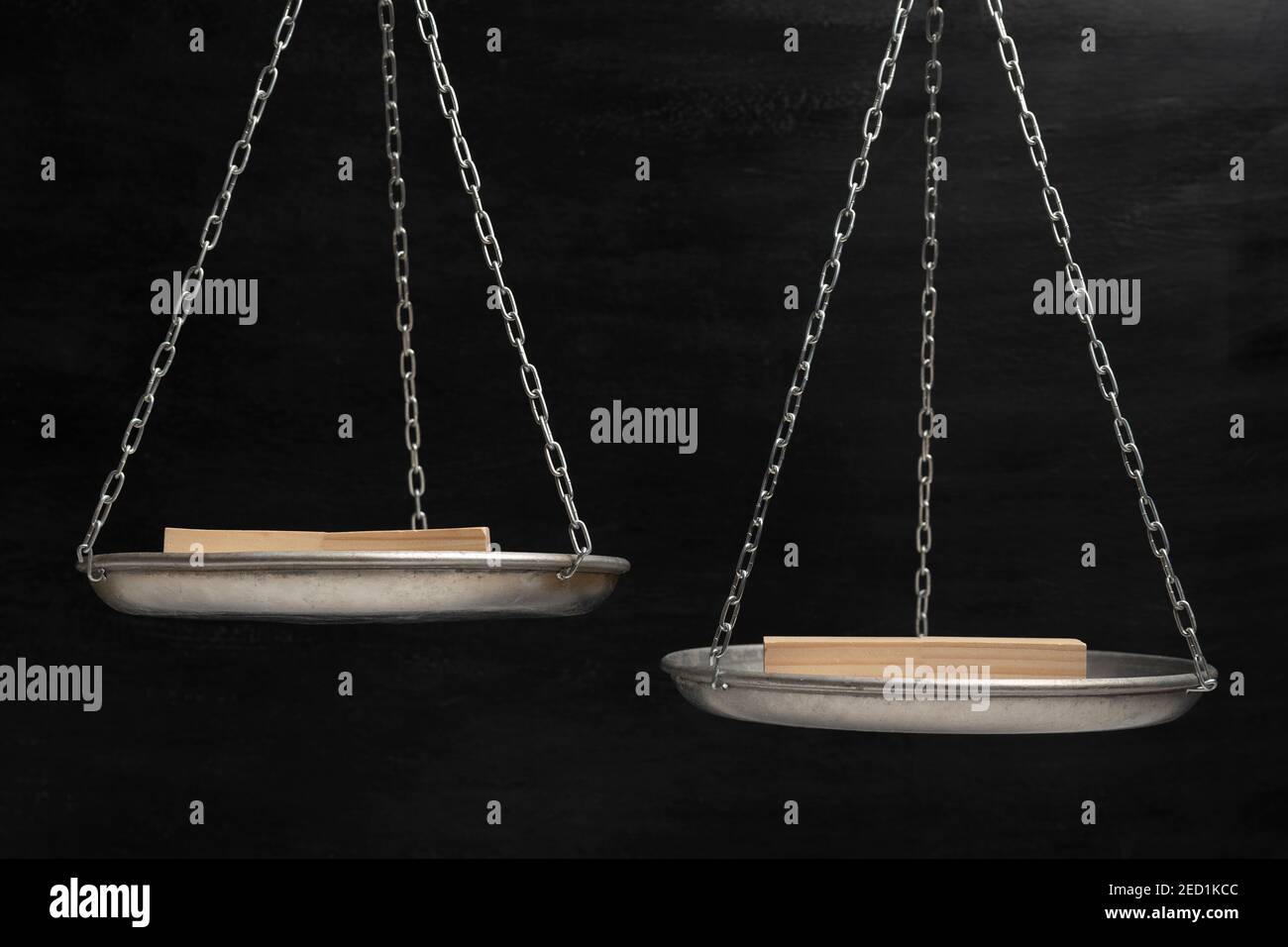 Balance scales on black background with wooden stands. Balance concept ...