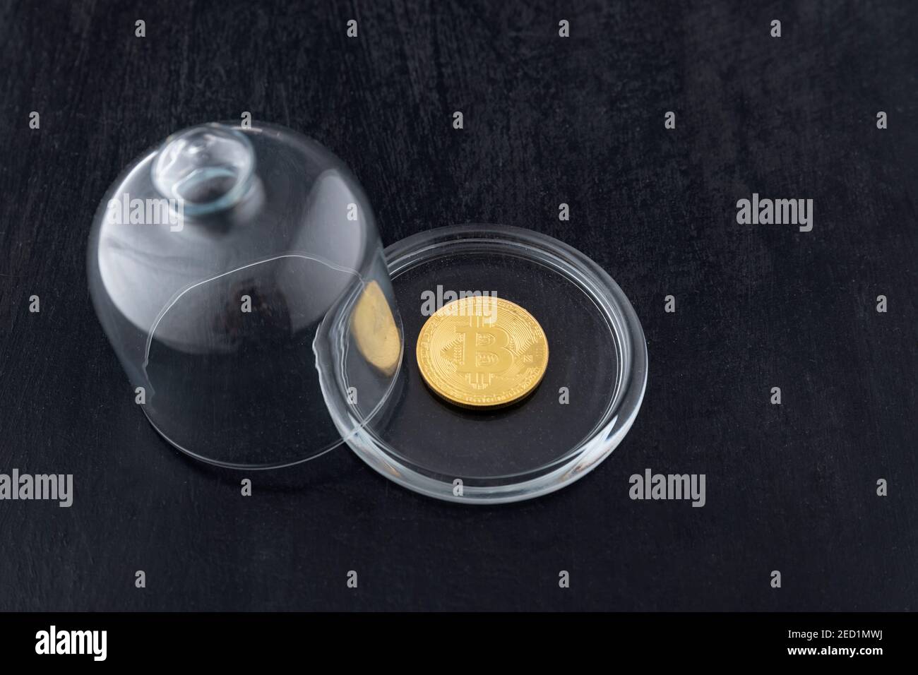 Bitcoin under glass cover. Bitcoin and bubble. Concept of instability ...