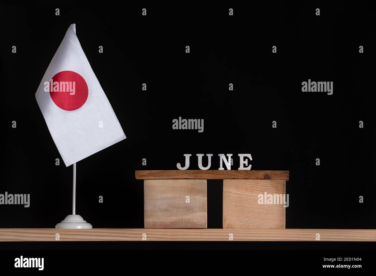 Wooden calendar of June with Japan flag on black background. Dates of ...