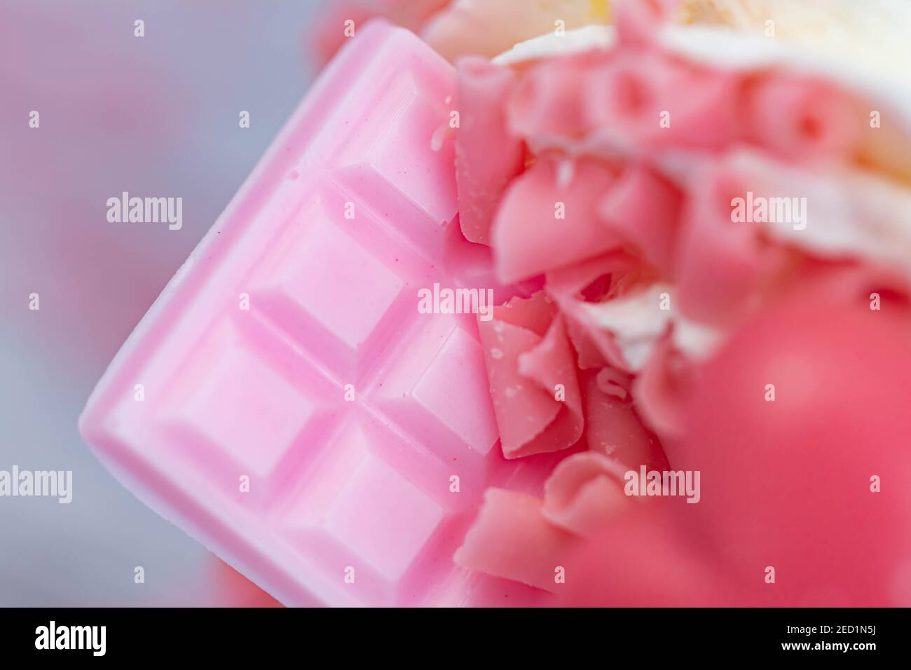 Sweet pink ruby chocolate bar. Grated chocolate close up Stock Photo ...