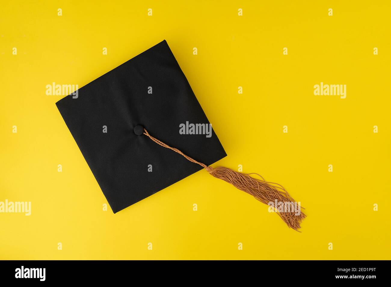 Graduation hat on yellow background. Student hat. Top view Stock Photo ...