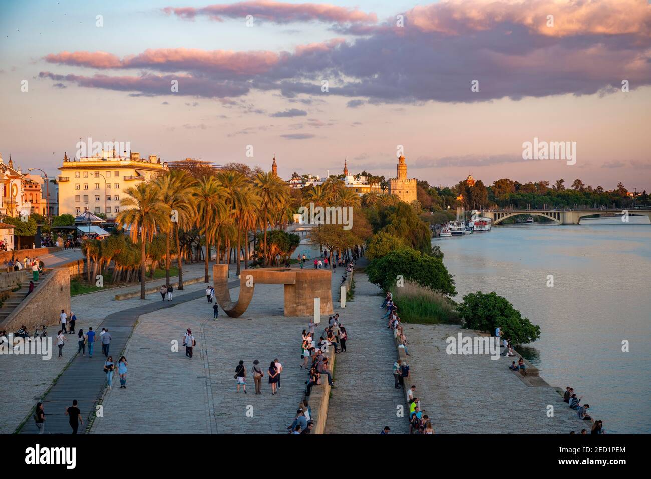 Waterfront promenade Muelle de la sal at the river Rio Guadalquivir ...