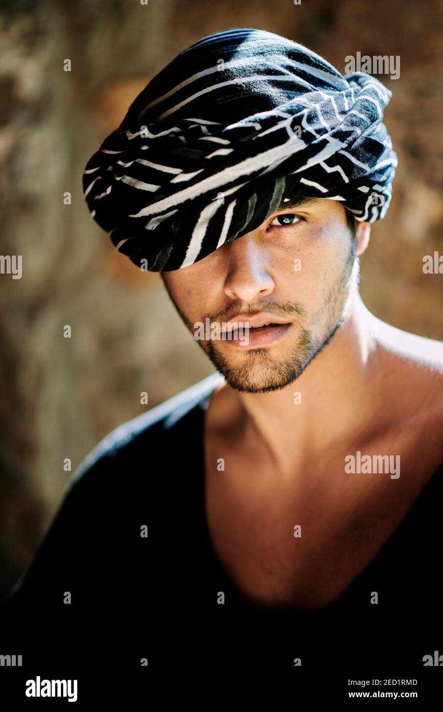Young sensual handsome ethnic arabic male with turban model wearing ...