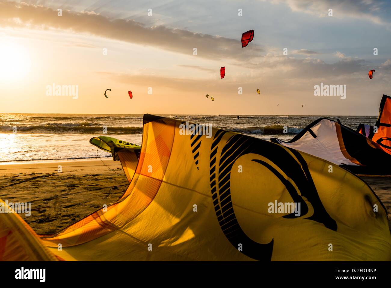 Kitesurfing beach, kiteboarding sport, kites n the beach and in the air ...