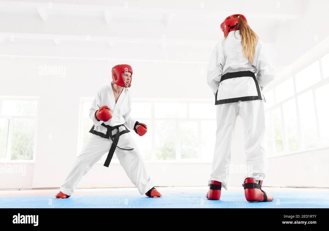 Young aggressive fighter standing ready to attack her opponent at ...