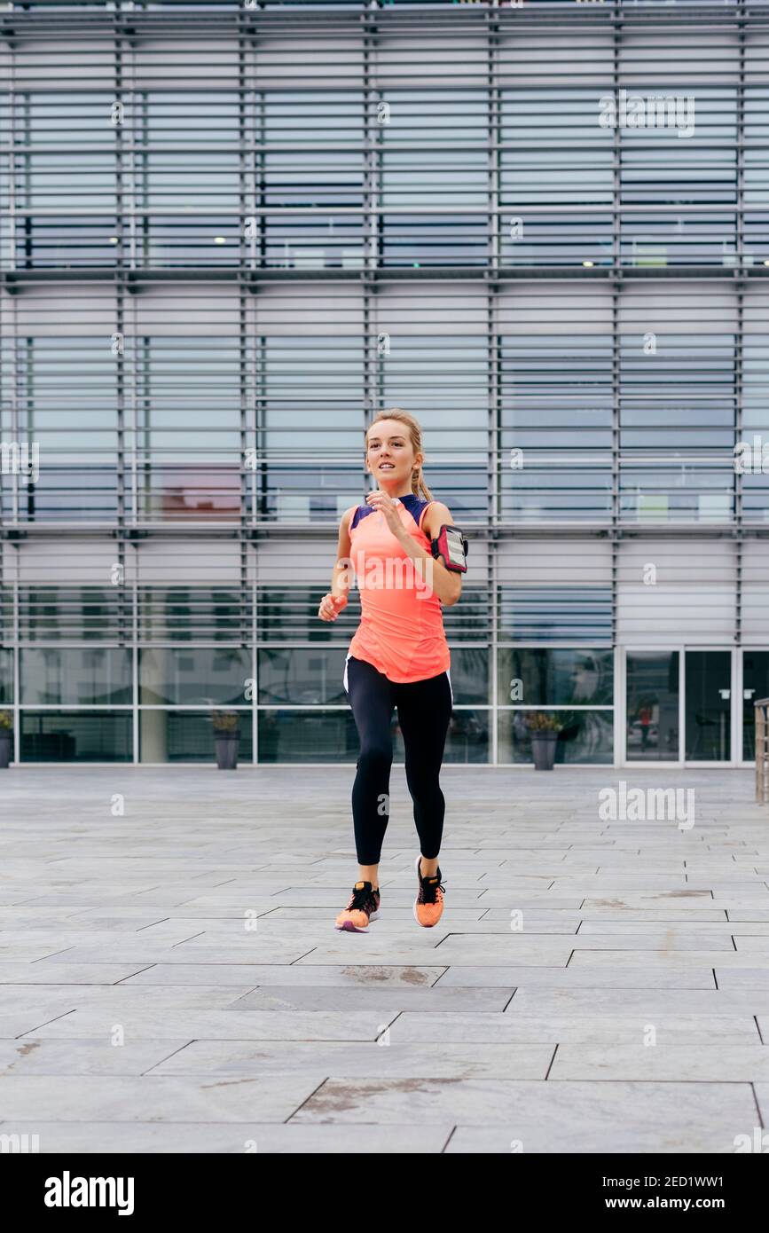 Attractive blonde woman running on hi-res stock photography and images ...