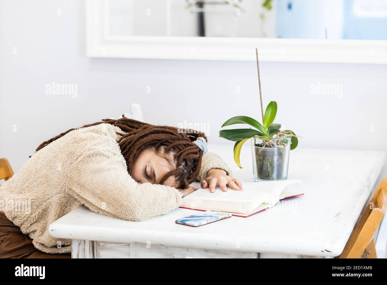 Girl asleep at a table hi-res stock photography and images - Alamy