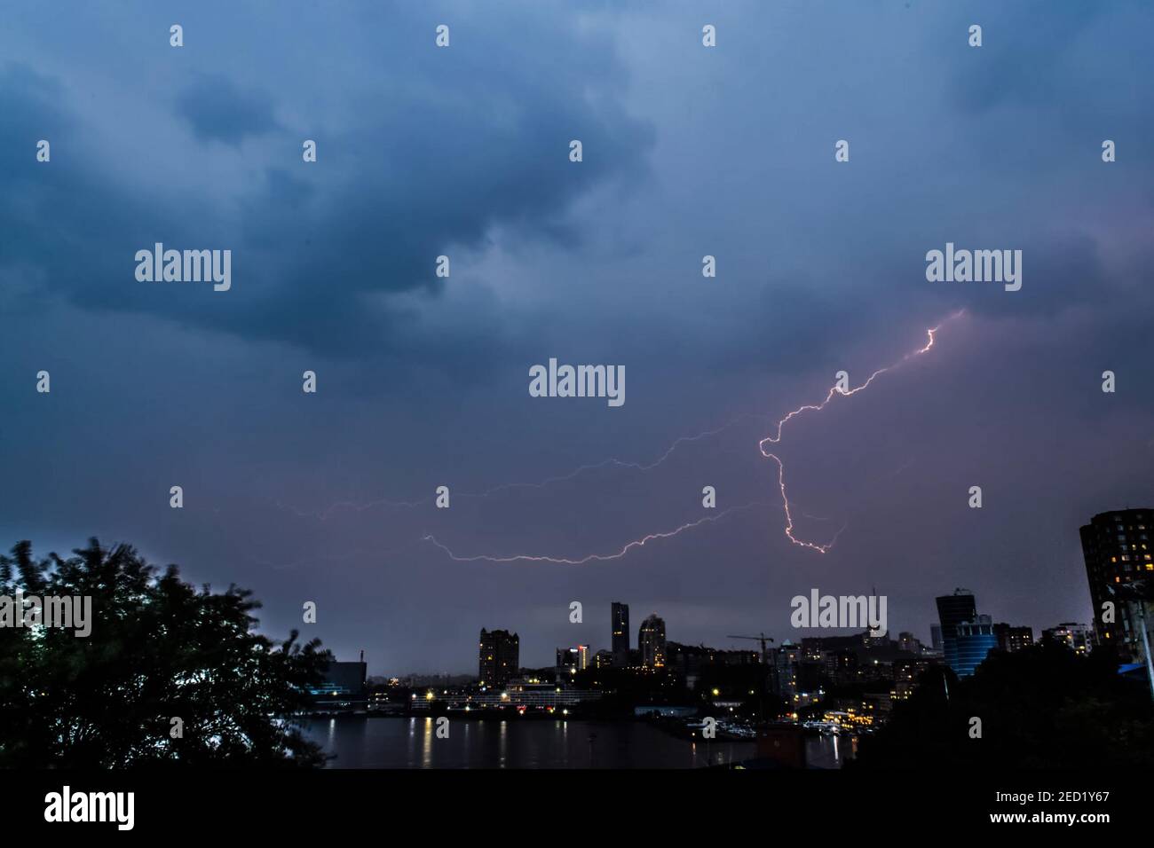 Lightning during a thunderstorm in the sky. Natural phenomenon of ...
