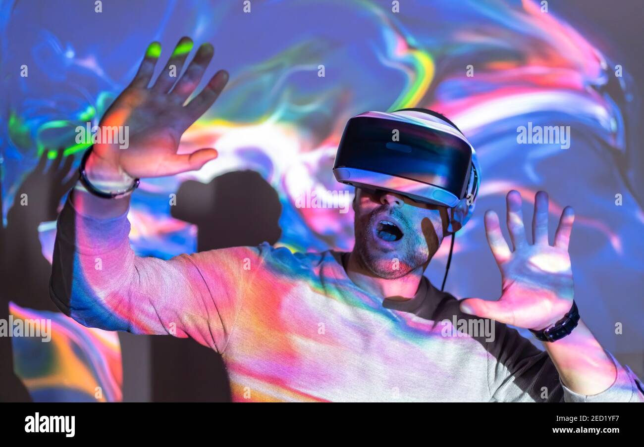 Side view of crop tattooed male sound engineer working with control ...