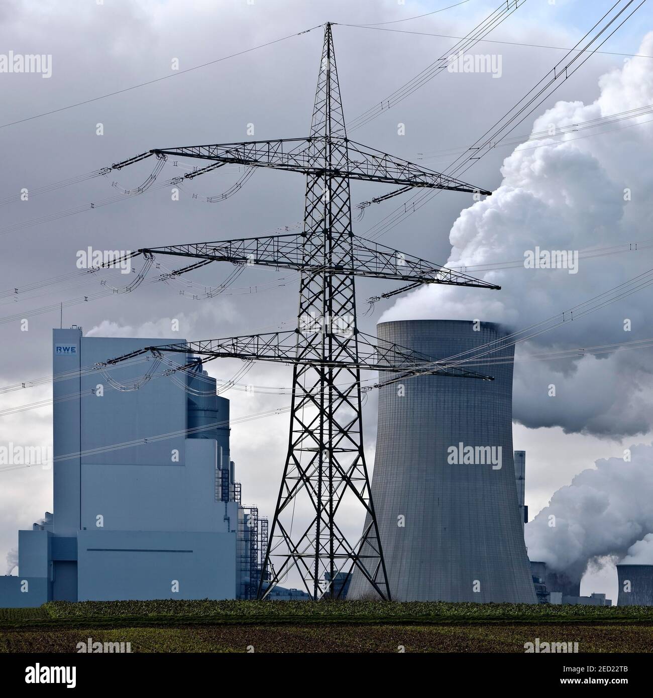 High-voltage electricity pylon or also overhead line pylon in front of ...