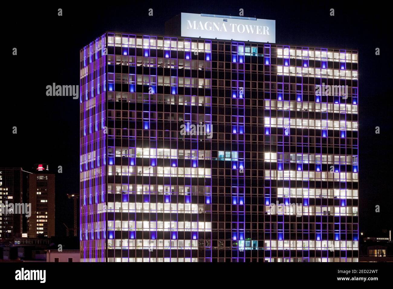 Illuminated Magna Tower in the evening, office high-rise in the ...