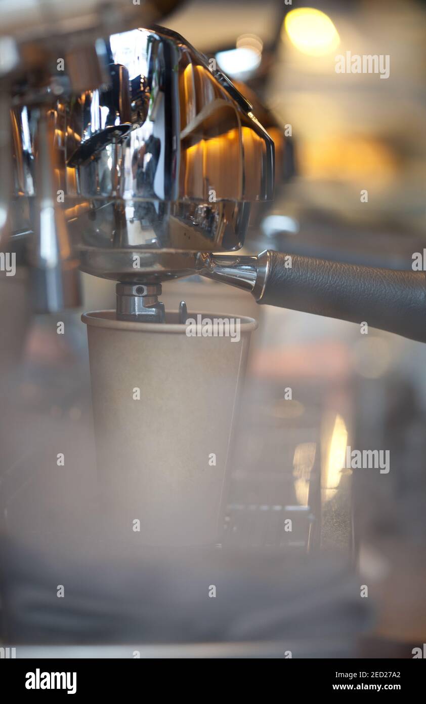 closeup of holders and steam in professional Victoria Arduino group ...