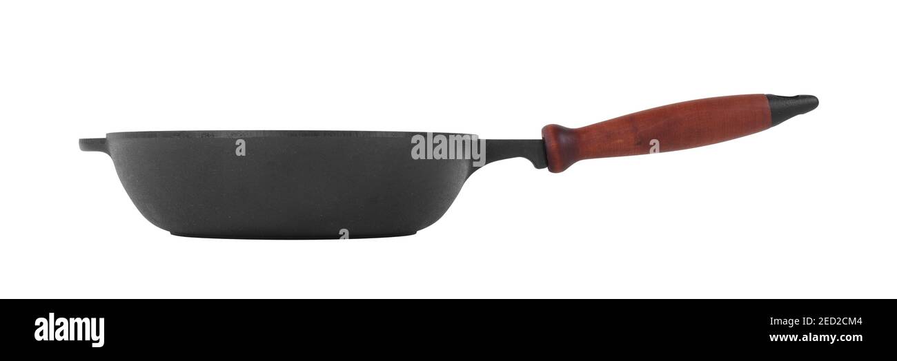 Kitchen accessories - Side view cast iron frying pan isolated on a ...