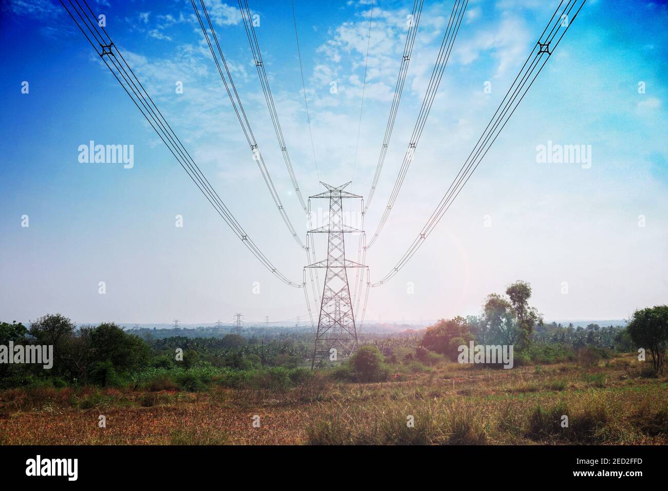 High voltage transmission towers line Stock Photo - Alamy