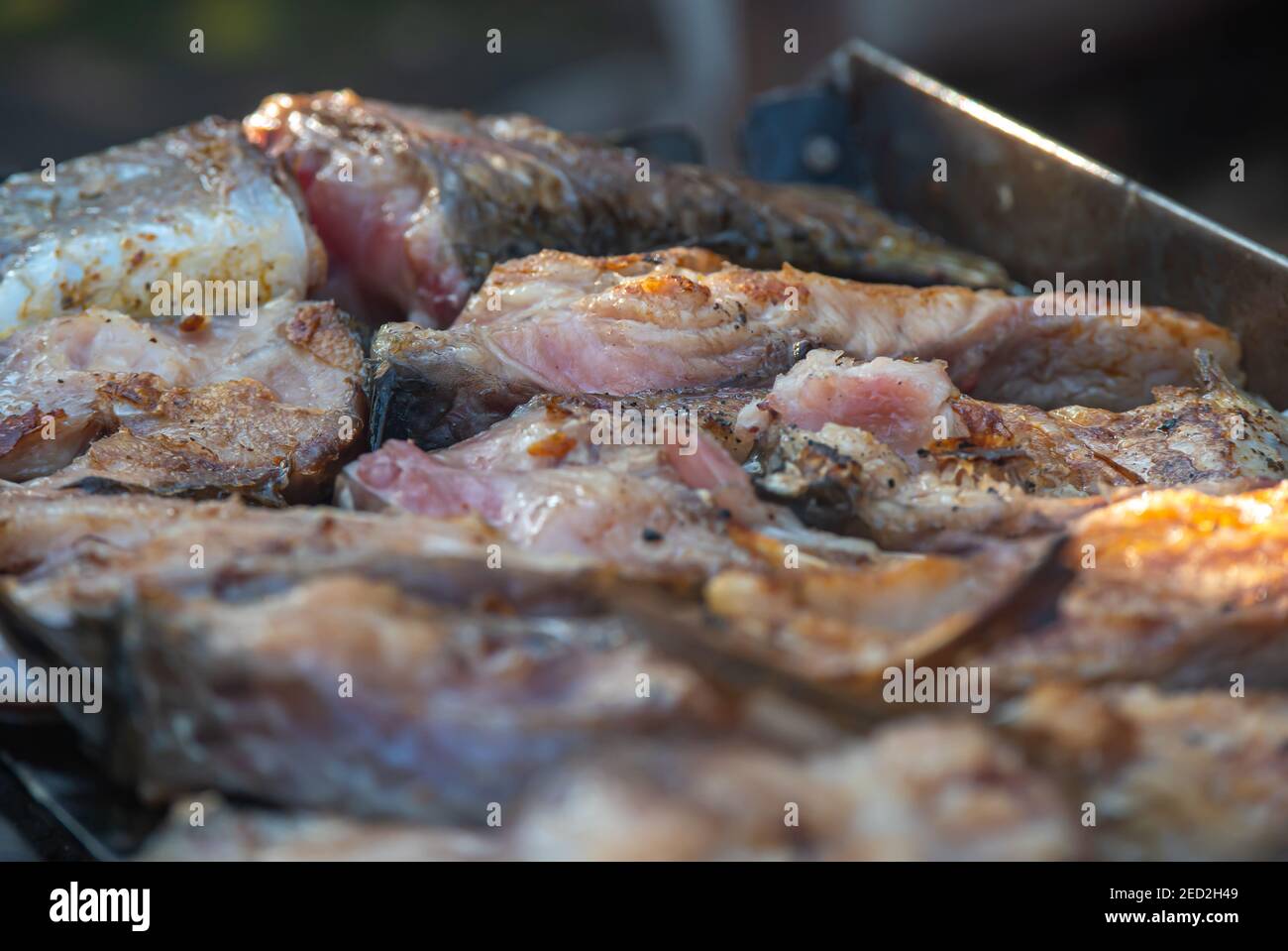 fish on the grilled roast cooking outdoor Stock Photo - Alamy