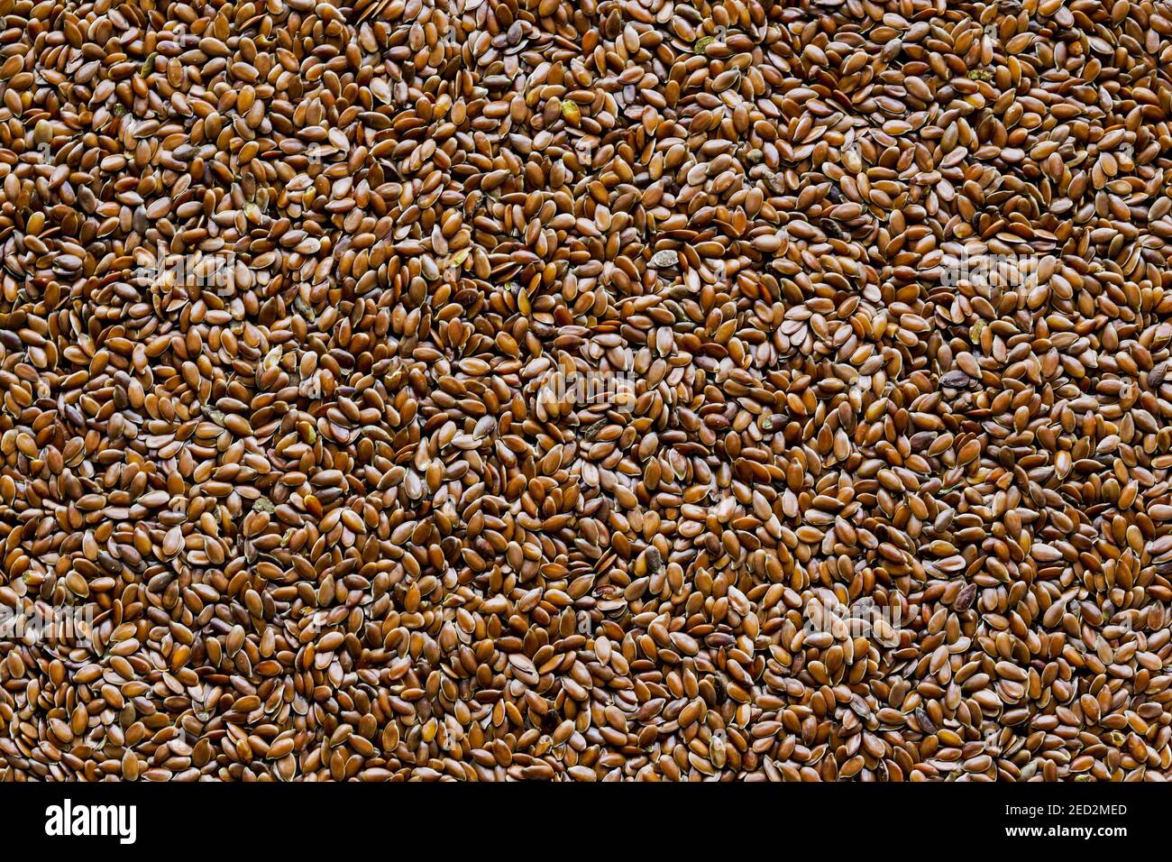 Linseed also Flaxseed grains as a brown background Stock Photo - Alamy