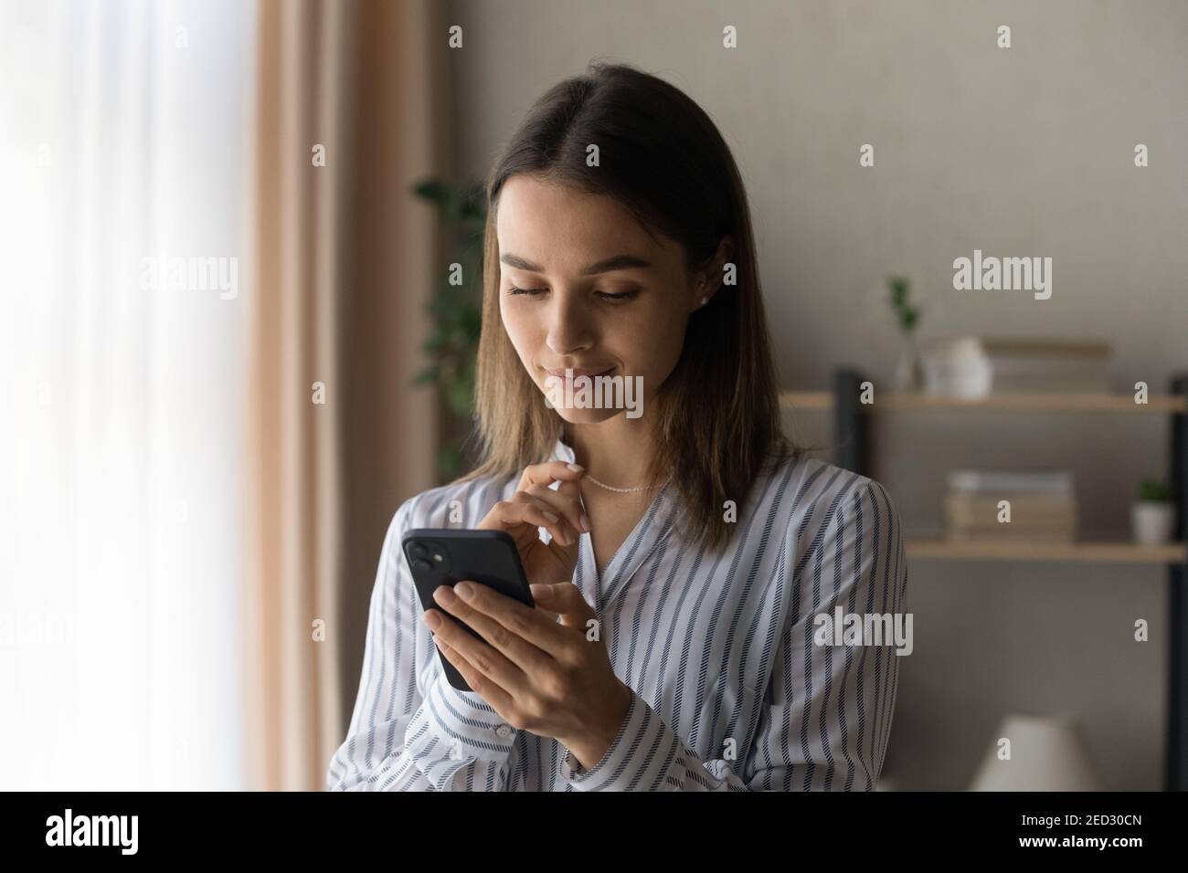 Teen female read pleasant message from beloved person on phone Stock ...