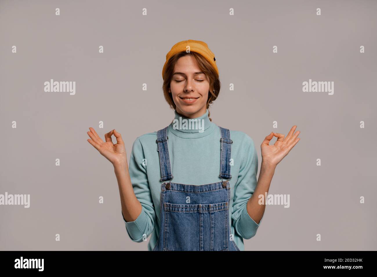 Photo of cute female hipster concentrated and relaxed meditation. White ...