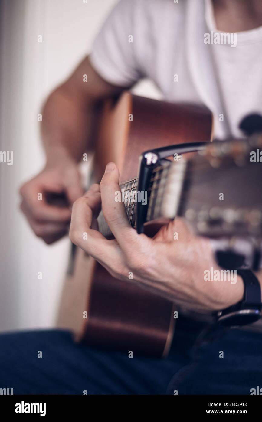 Detail on the artist's fingers as they flick over the instrumental ...