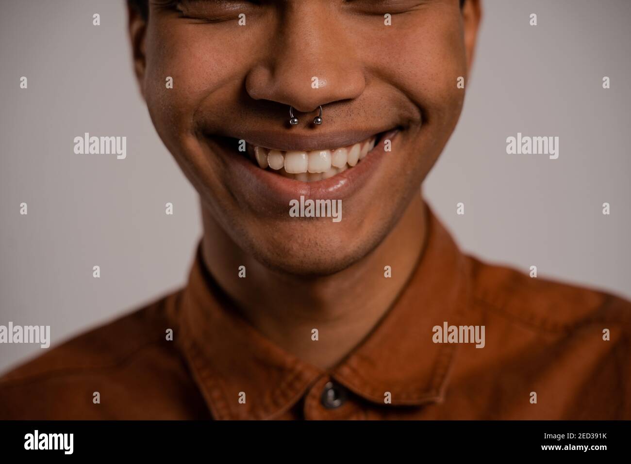 Close up photo of smile black man and his nice teeth. Male wears shirt ...