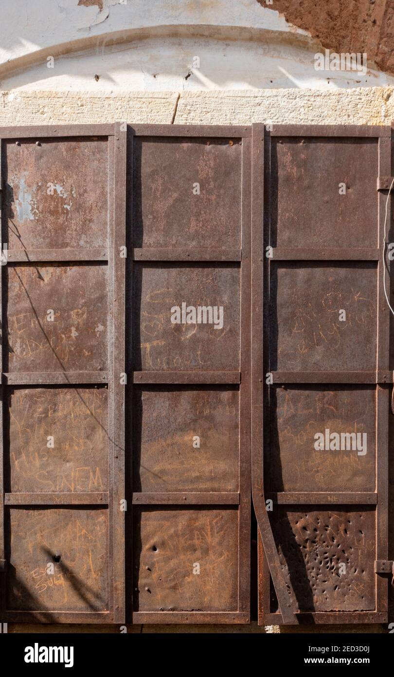 Old rusted iron closed shutter fitted on the window Stock Photo - Alamy