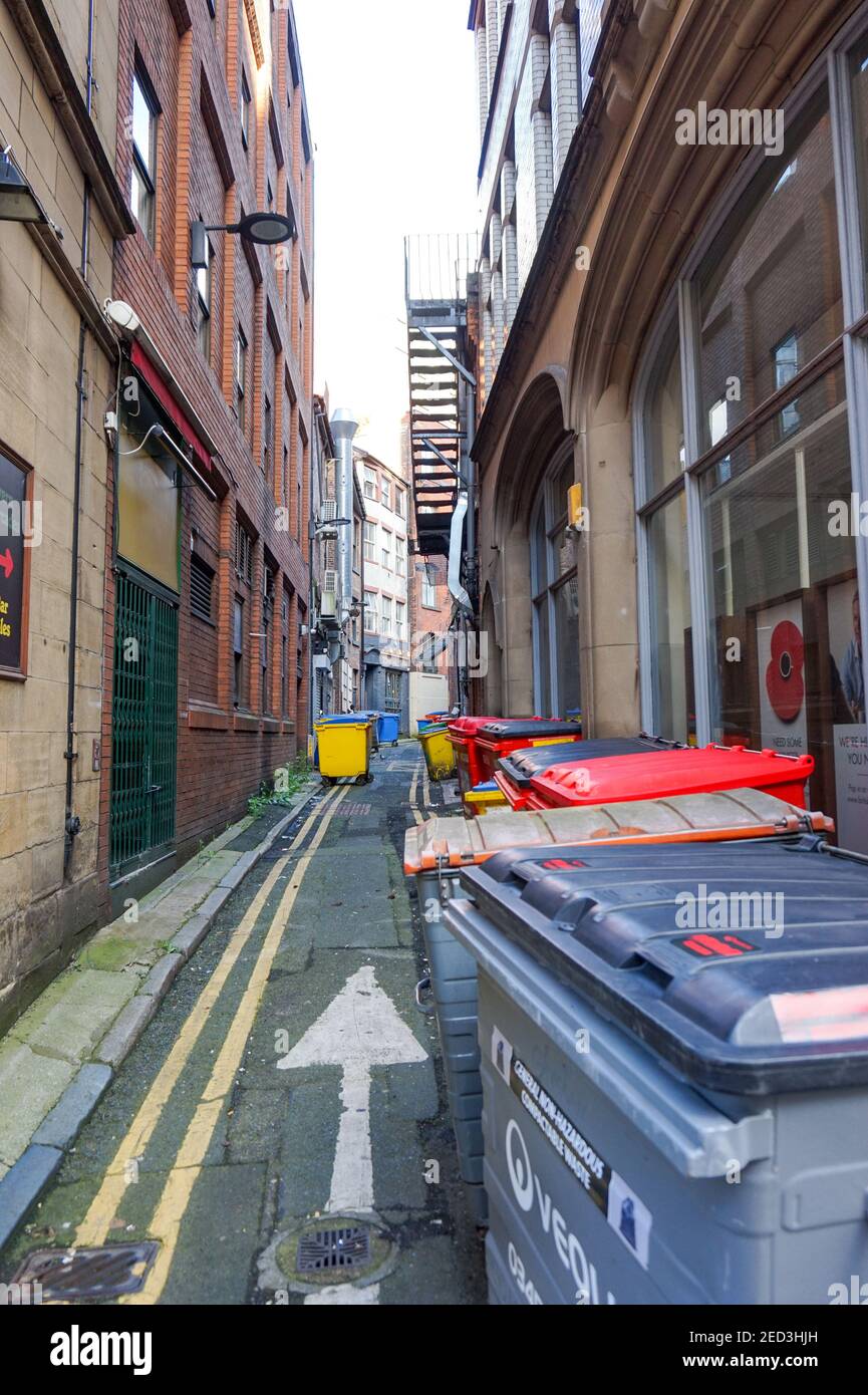 Manchester city centre back side street, trash rubbish bins, England ...