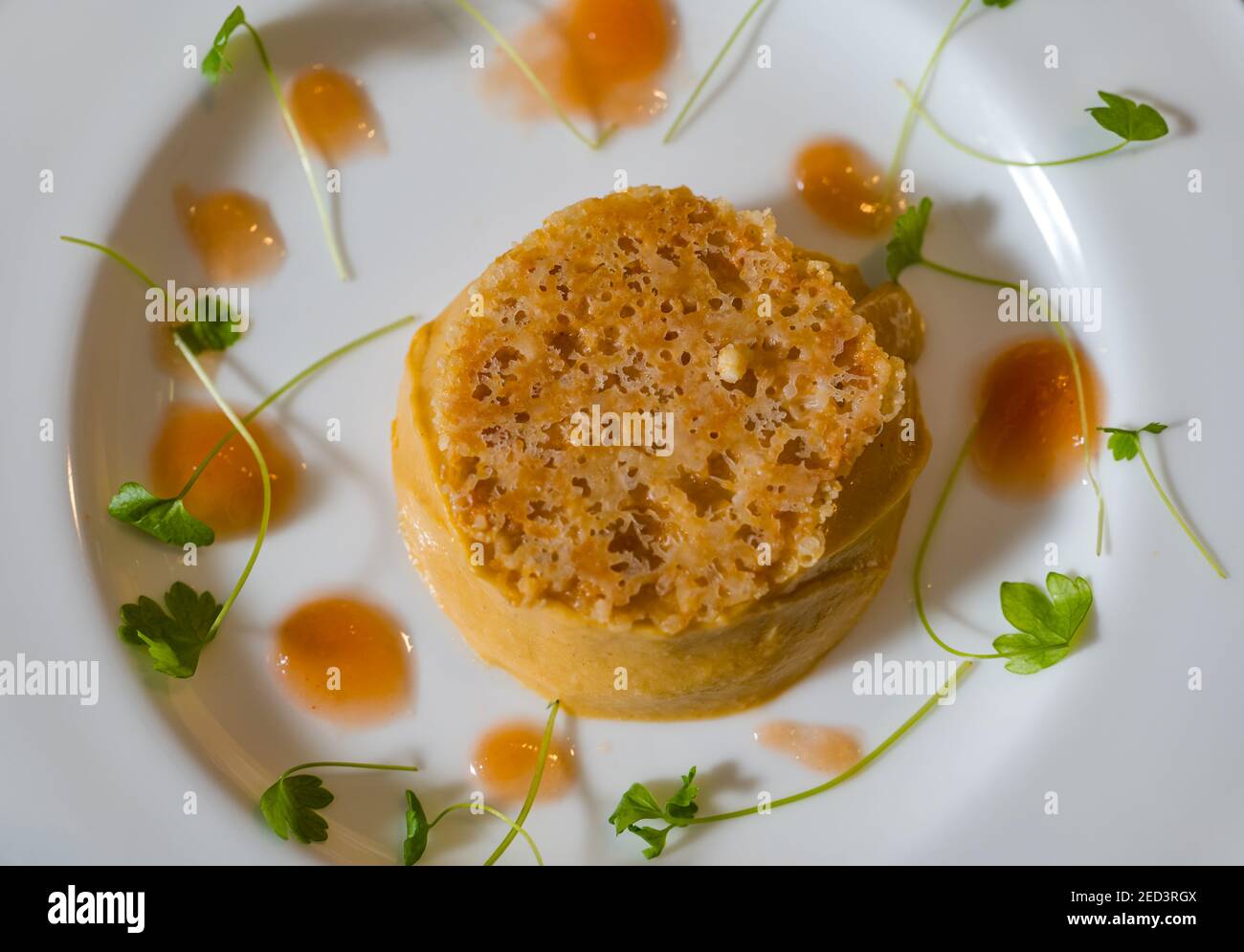 Fine dining plate of food of lobster creme brulee with parmesan crisp ...
