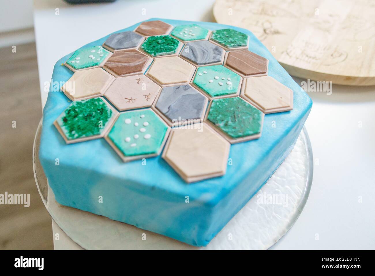 Colorful cake in settlers of catan game look on table Stock Photo - Alamy