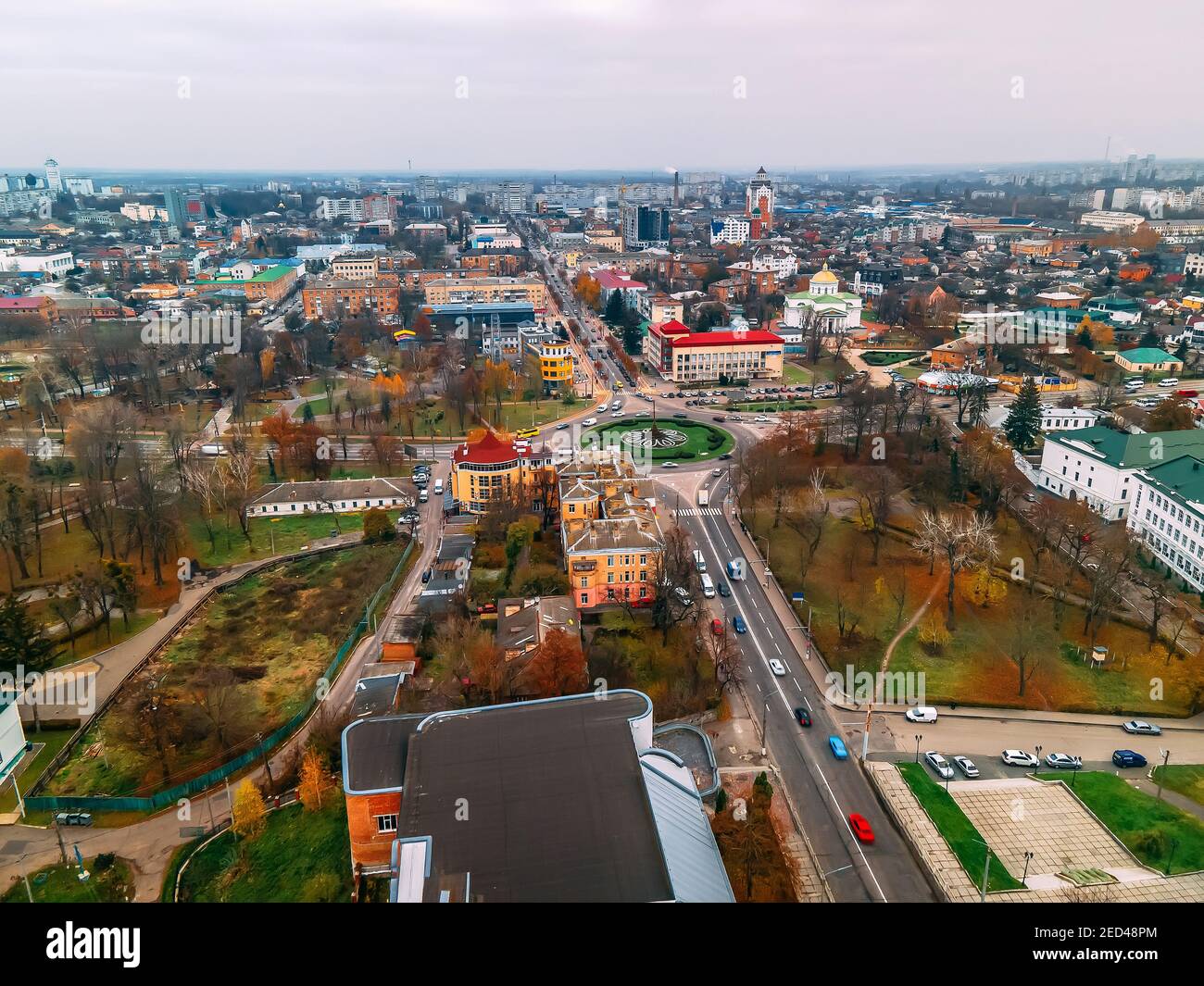 Aerial view of roundabout road with circular cars in small european ...