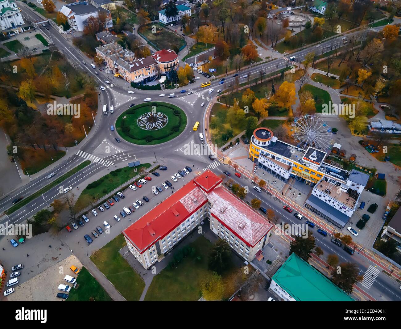 Aerial view of roundabout road with circular cars in small european ...