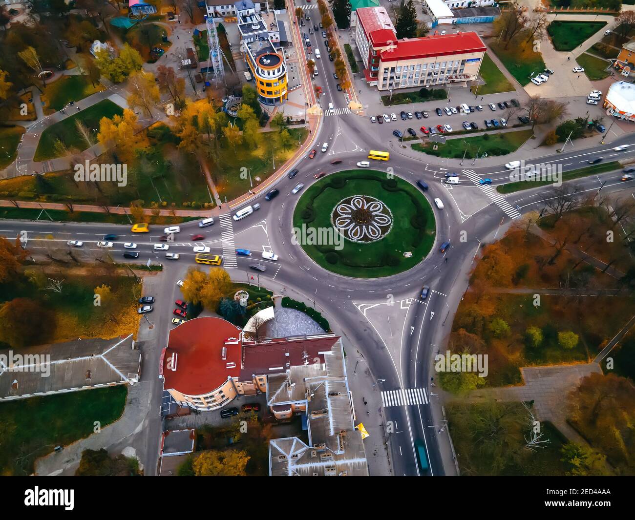 Aerial view of roundabout road with circular cars in small european ...