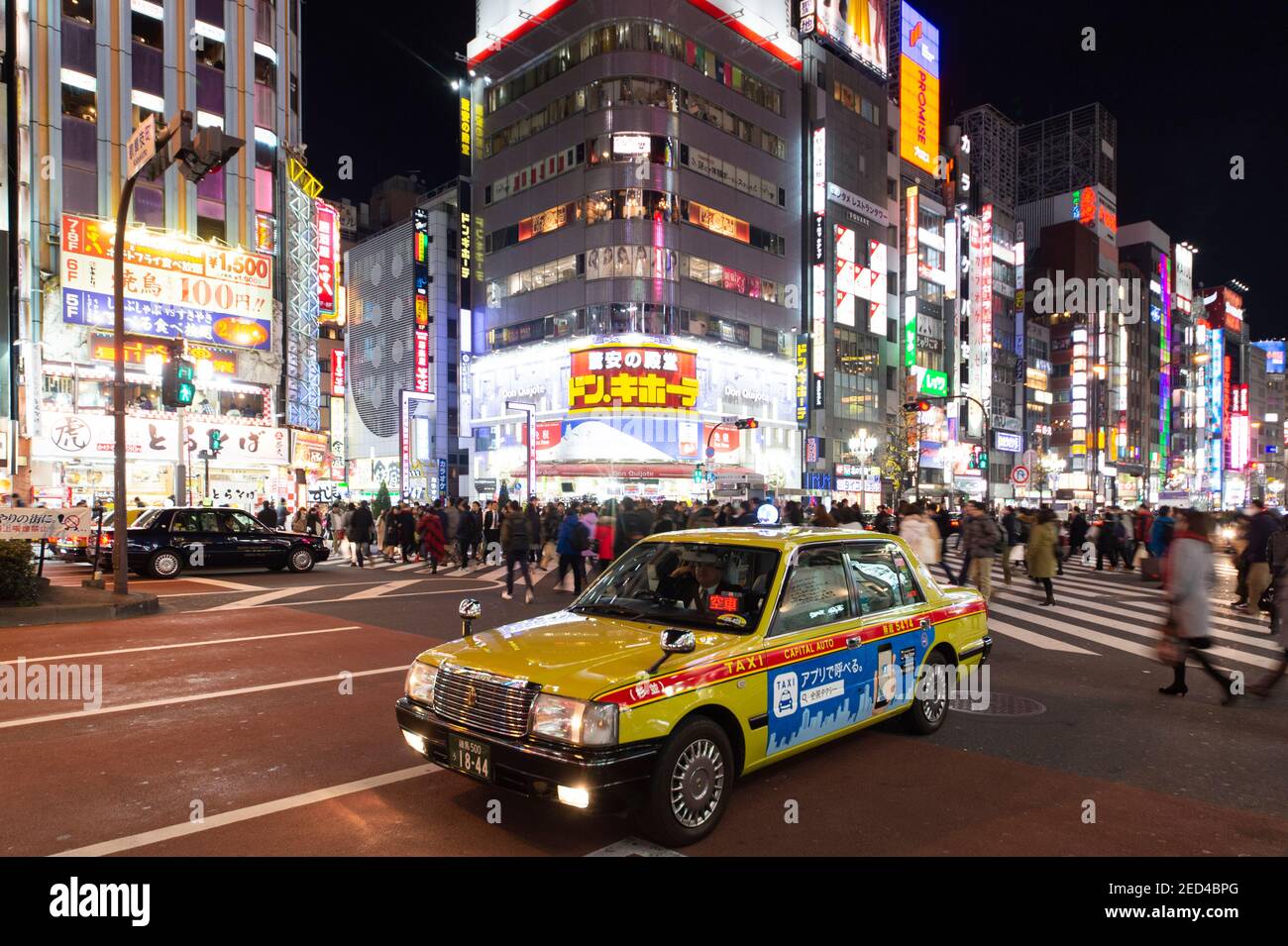 A taxi driver is waiting to pick up some customers on the streets of ...