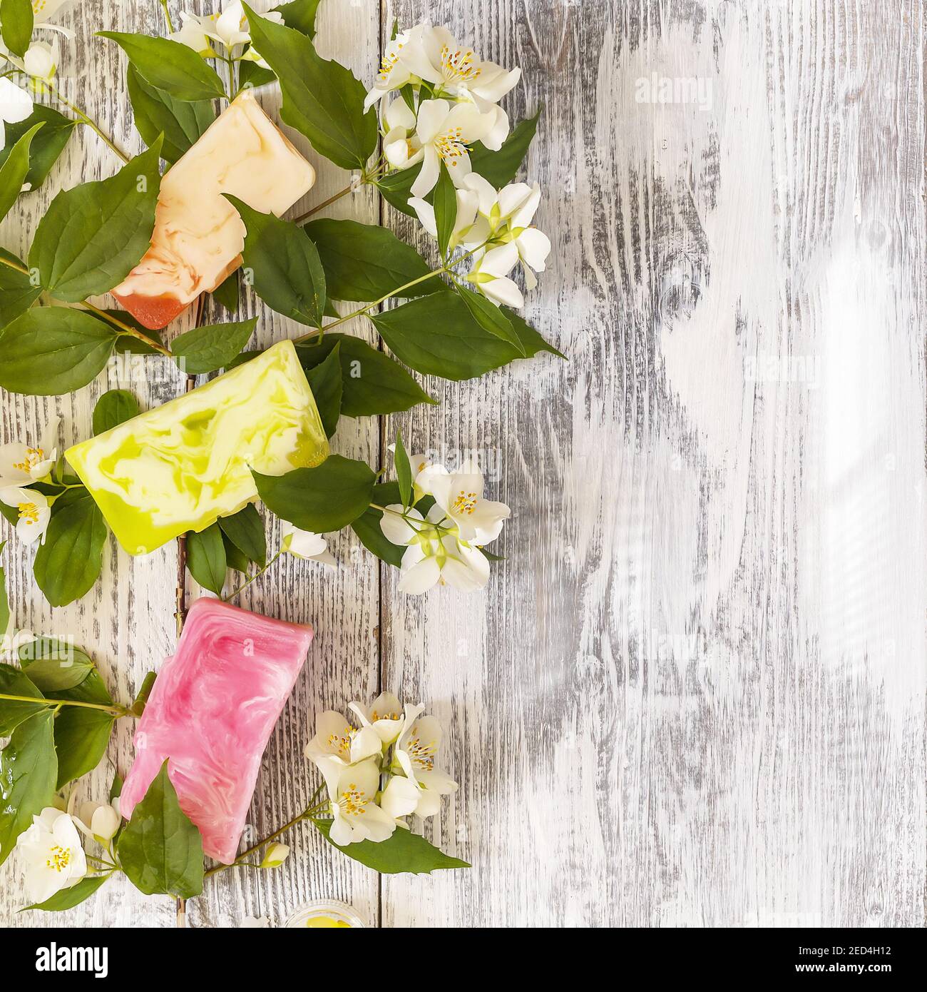 Bars of handmade natural flower soap or dry shampoo on a blooming ...