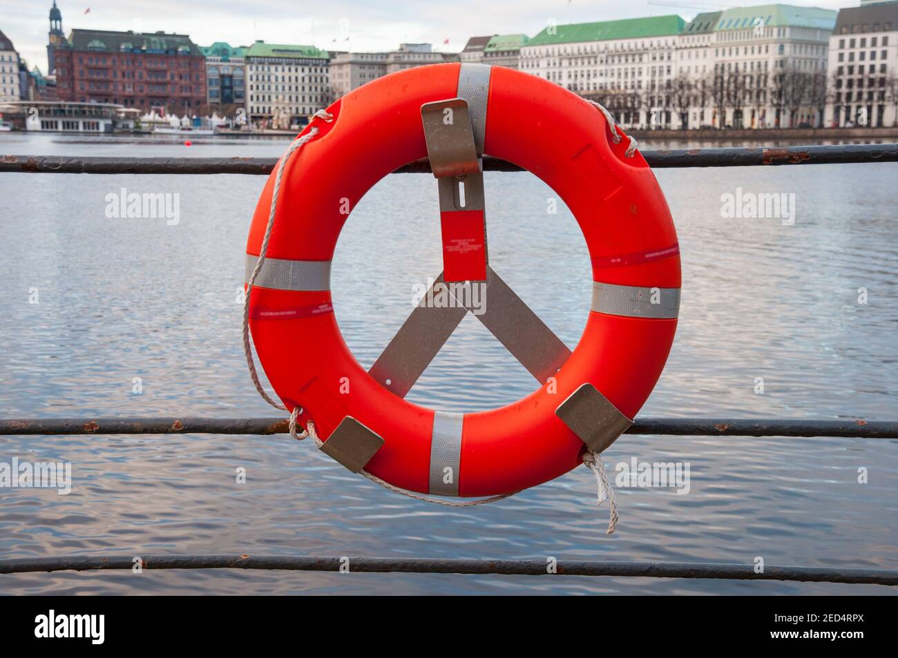 Lifebuoy an the edge of a lake in the city Stock Photo - Alamy