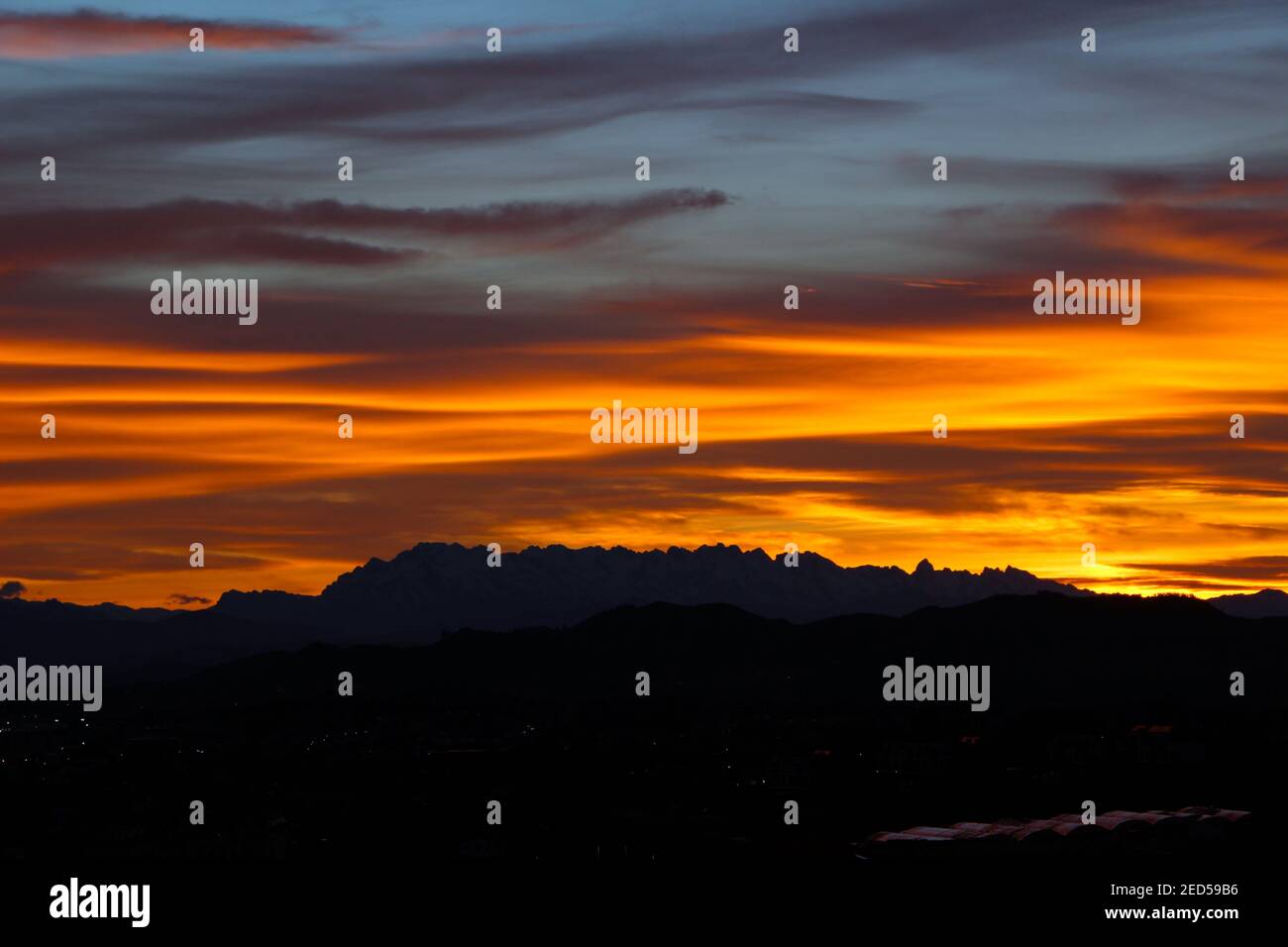Orange cloud with the Picos de Europa mountain range in the distance at ...