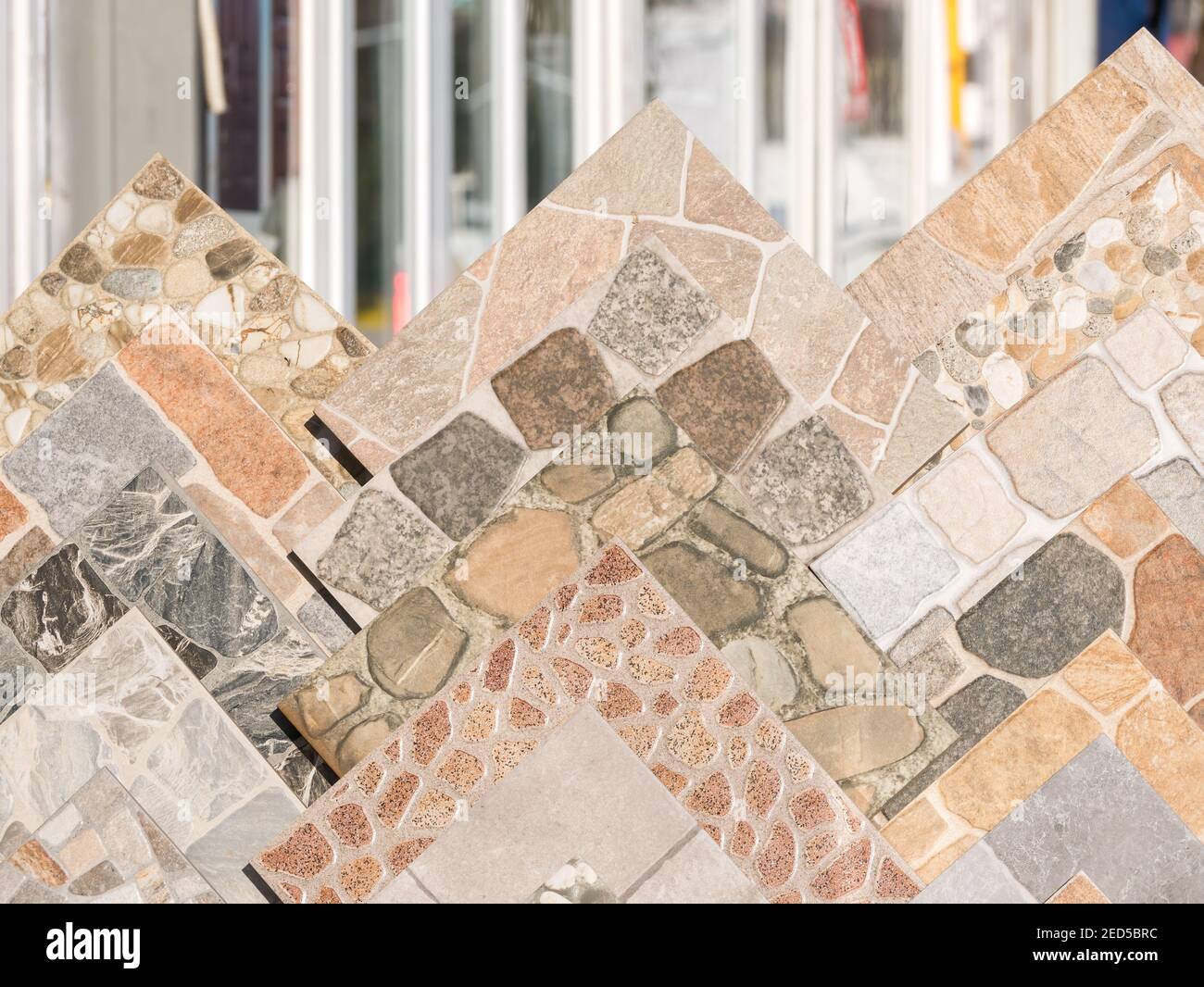Many different models of floor tiles on display for sale Stock Photo ...