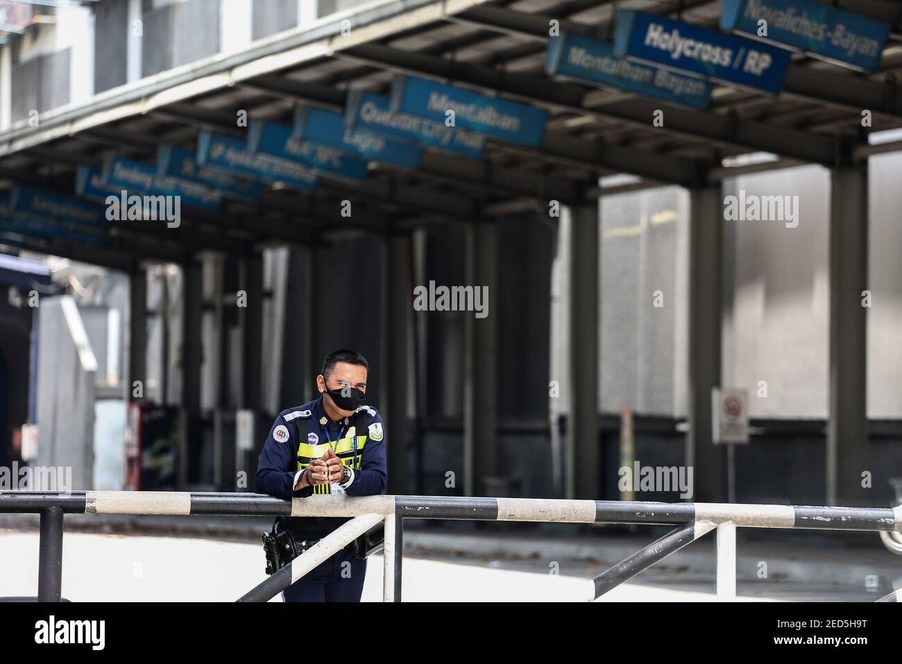 A security guard patrols an empty bus terminal during an enhanced ...