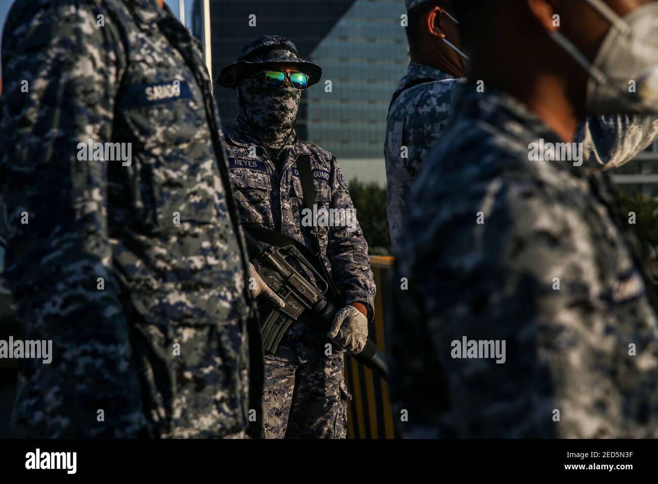 Members of the Philippine Coast Guard patrol the seaside near ...