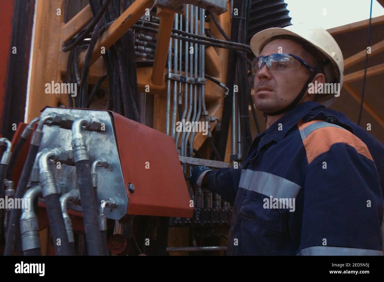 Surgut, Russia - August 28, 2019: Man at the control panel. Levers for ...