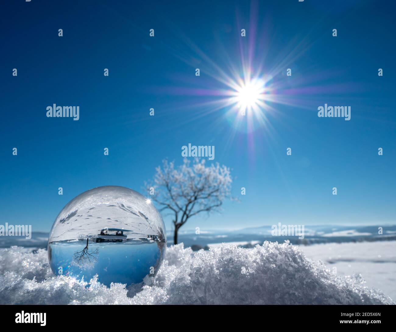 romantic winter landscape in a glass ball Stock Photo - Alamy