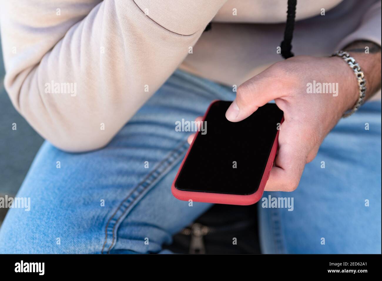 Mobile phone in mens hand. Top view of man holding smartphone with ...