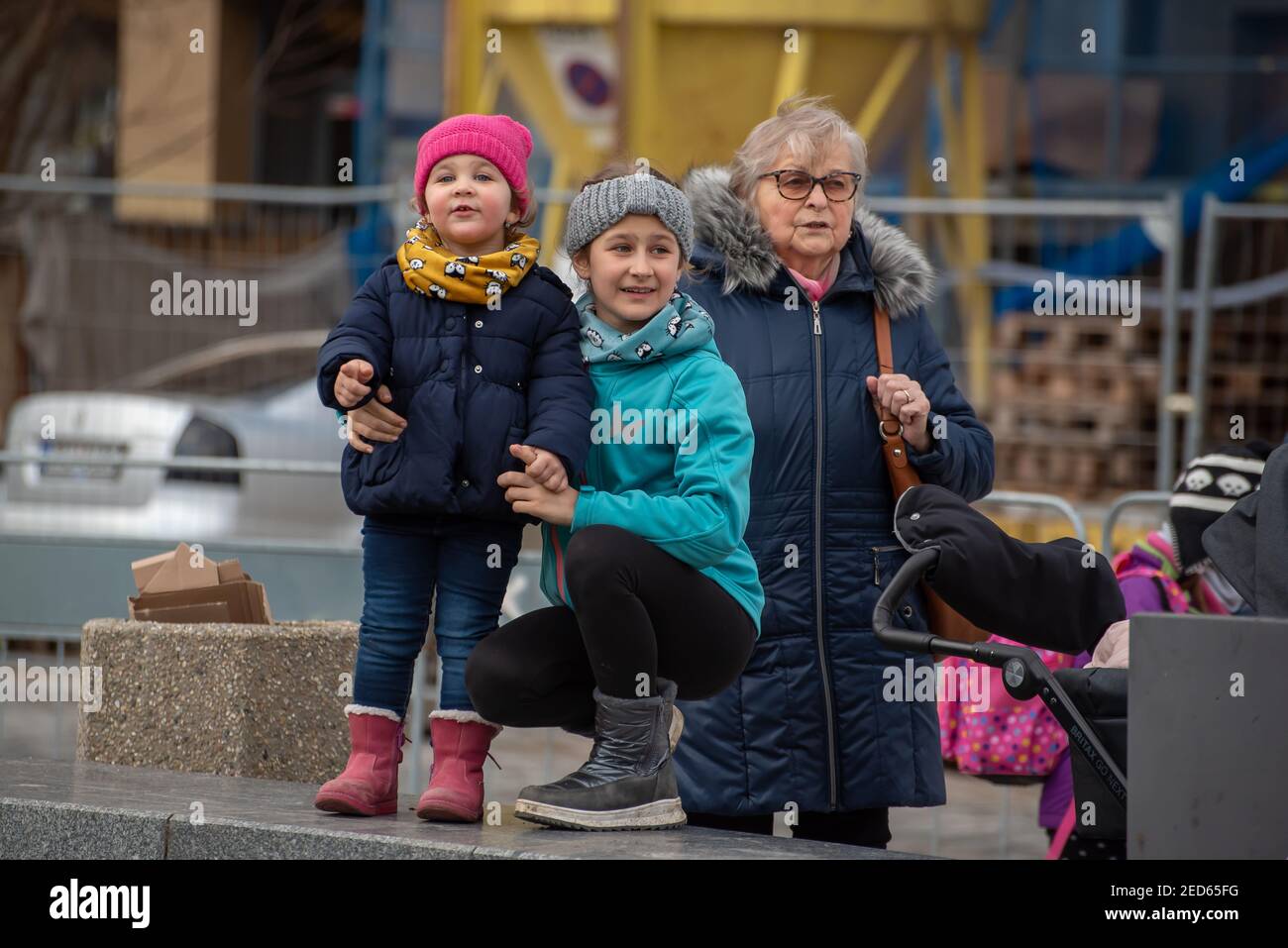 Prague, Czech Republic. 02-13-2021. Two kids with their Granny in the ...