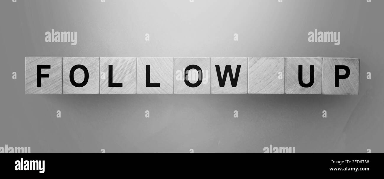 FOLLOW UP words written on wooden building blocks. Social media ...